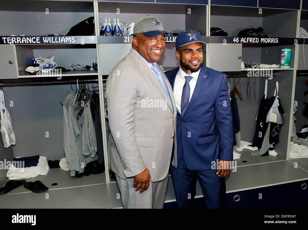 Stacy Elliott, left, poses with his son Ezekiel, right, the Dallas ...
