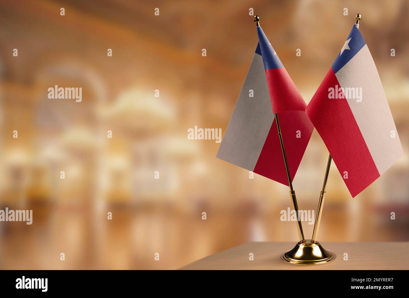 Small flags of the Chile on an abstract blurry background Stock Photo ...