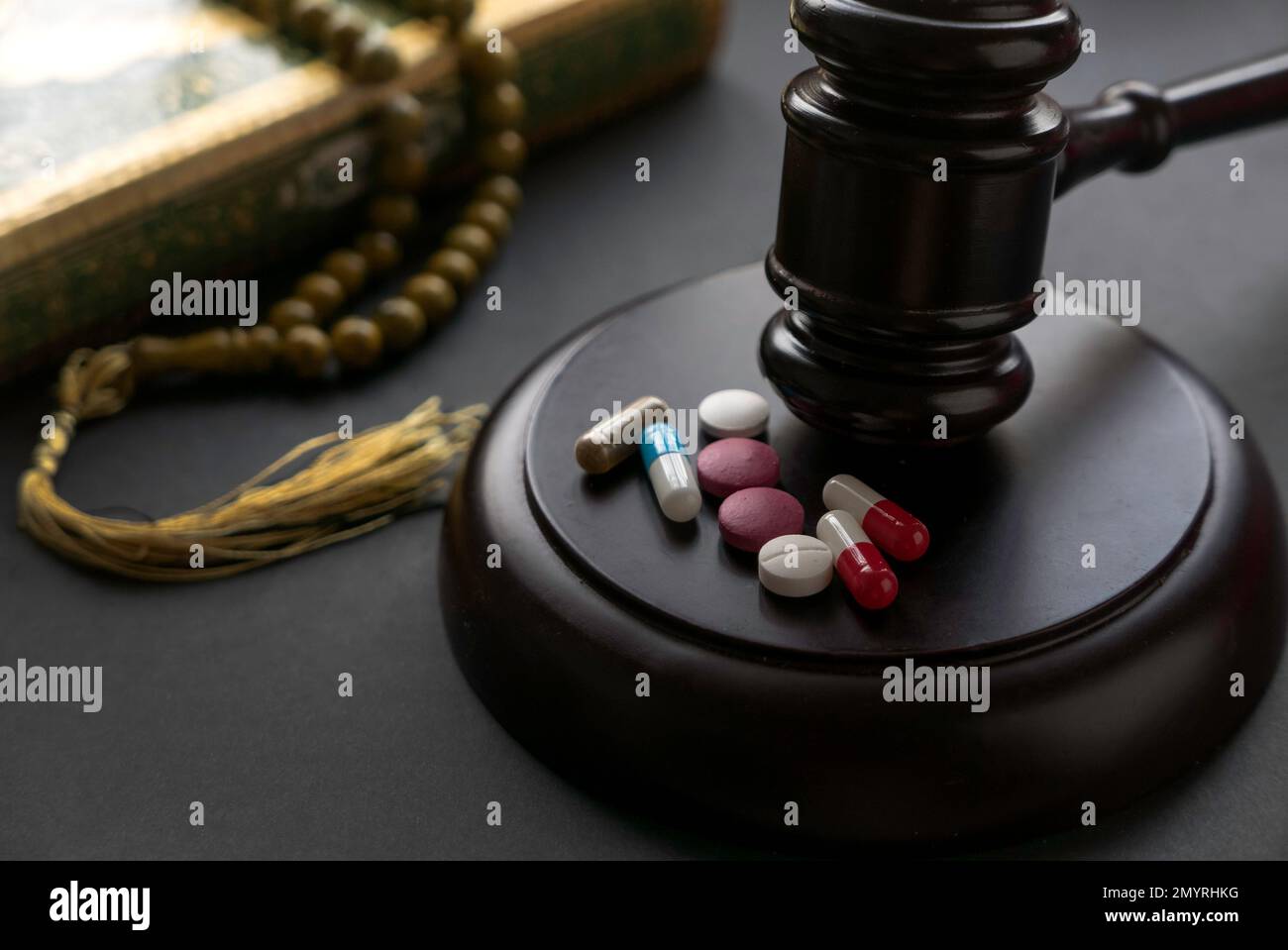 Concept of sharia law and drugs. Medicine pill and tablet, with gavel ...