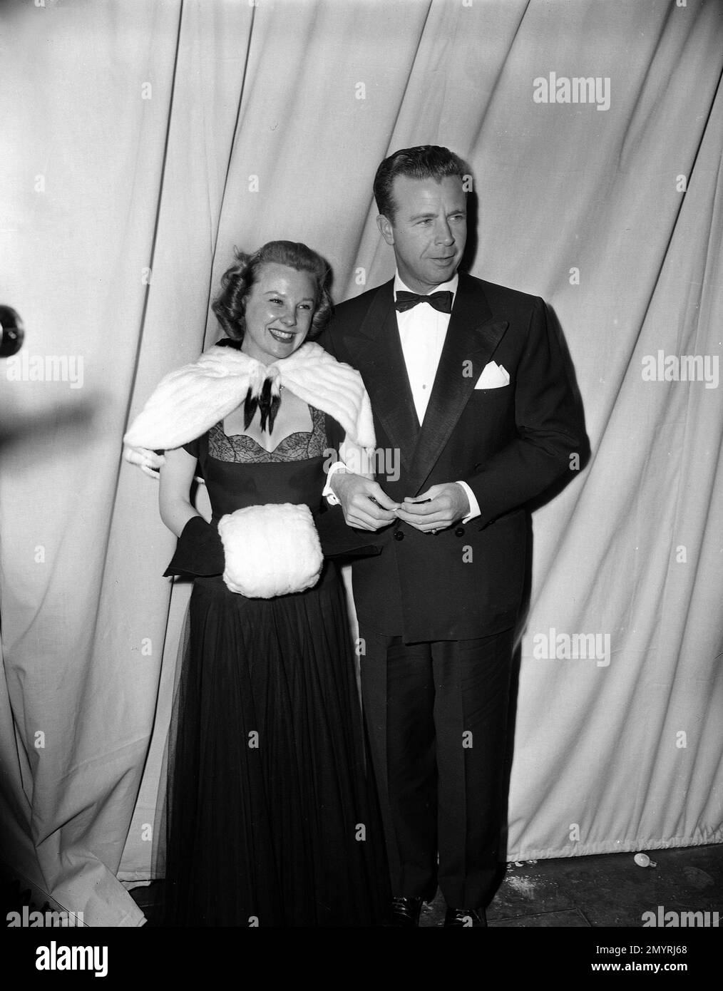 Dick Powell and his wife June Allyson, arrive for the Academy Awards ...