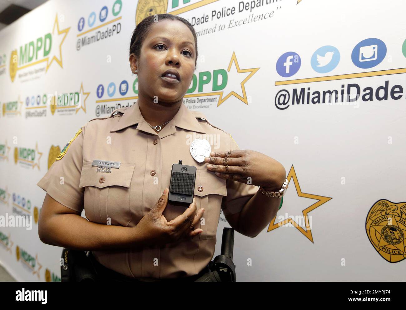 Miami-Dade Police Department PIO Marjorie Eloi shows how to turn on and ...