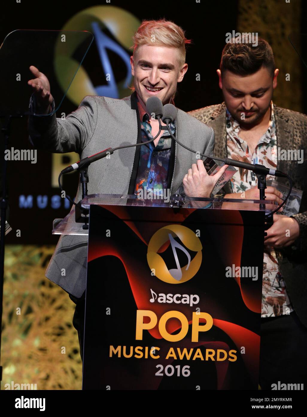 Nicholas Petricca of Walk The Moon accepts the Vanguard award at the ...