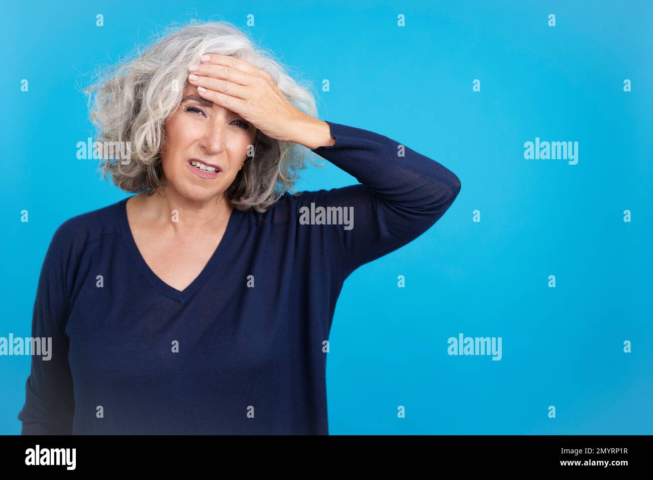 Person touching forehead hi-res stock photography and images - Alamy