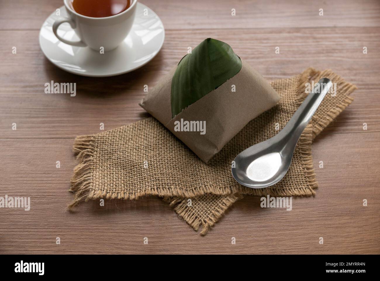 Nasi lemak , a popular malaysia breakfast serve with a cup of tea Stock ...