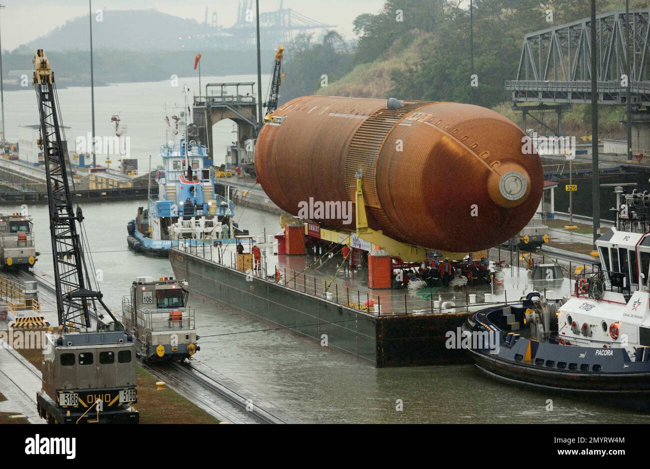 A tugboat and barge transporting NASA's only remaining space shuttle ...