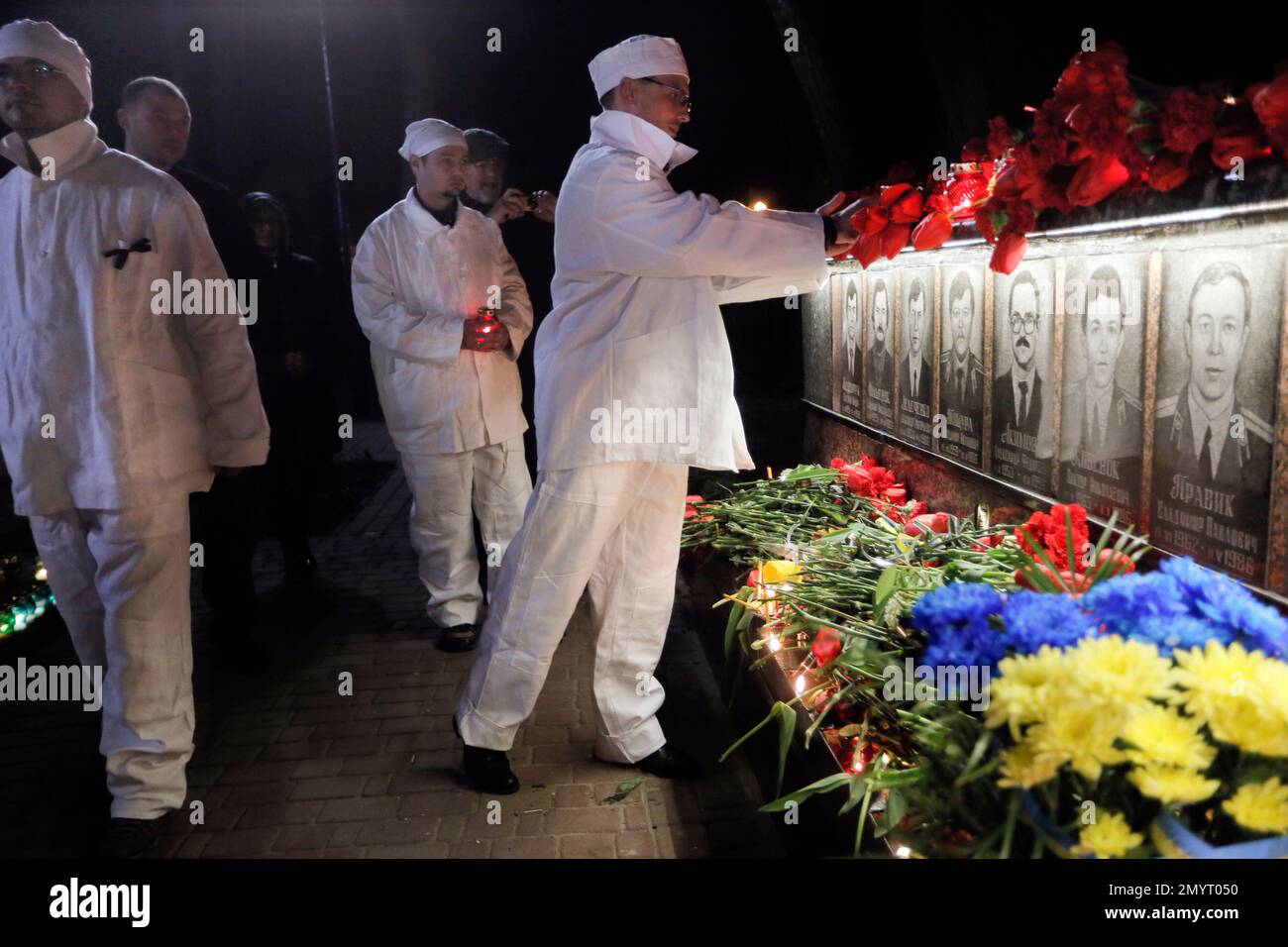 The Chernobyl nuclear plant workers in uniform attend a ceremony to ...