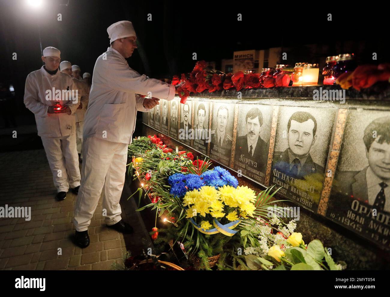The Chernobyl nuclear plant workers in uniform attend a ceremony to ...