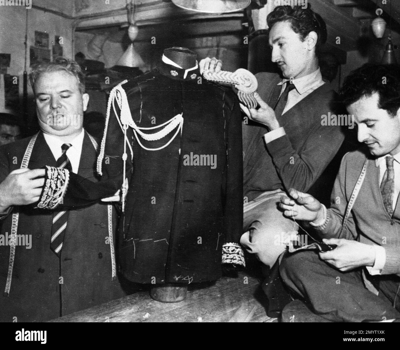 Epaulettes and gold braid festoon the wedding uniform which these ...