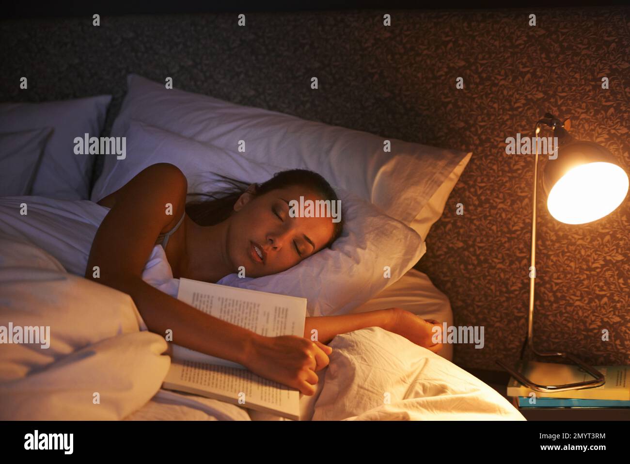 Sometimes you just cant put the book down. Attractive young female ...