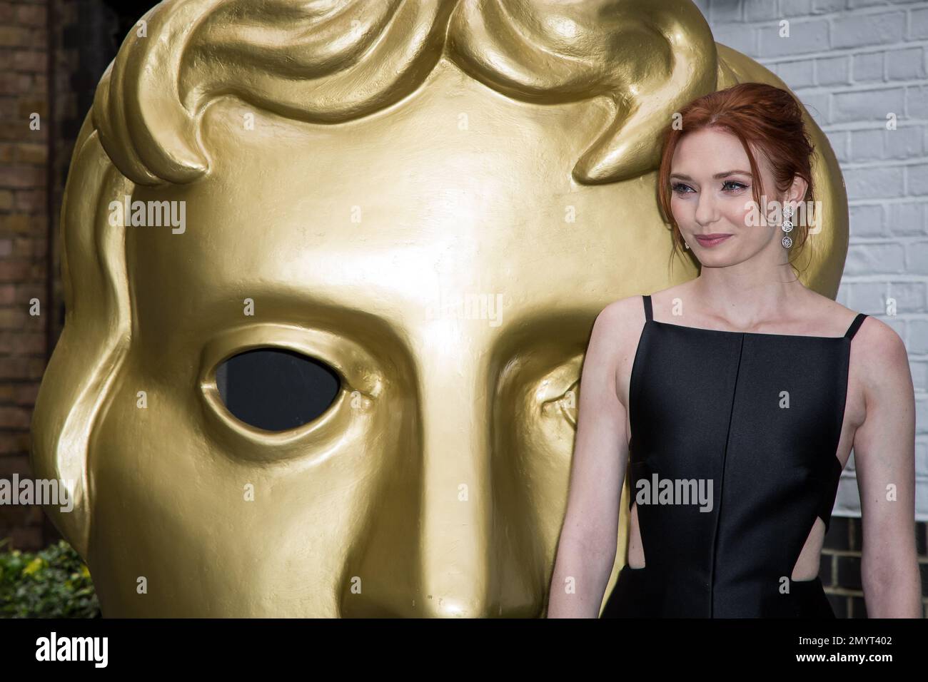 Actress Eleanor Tomlinson poses for photographers upon arrival at the ...