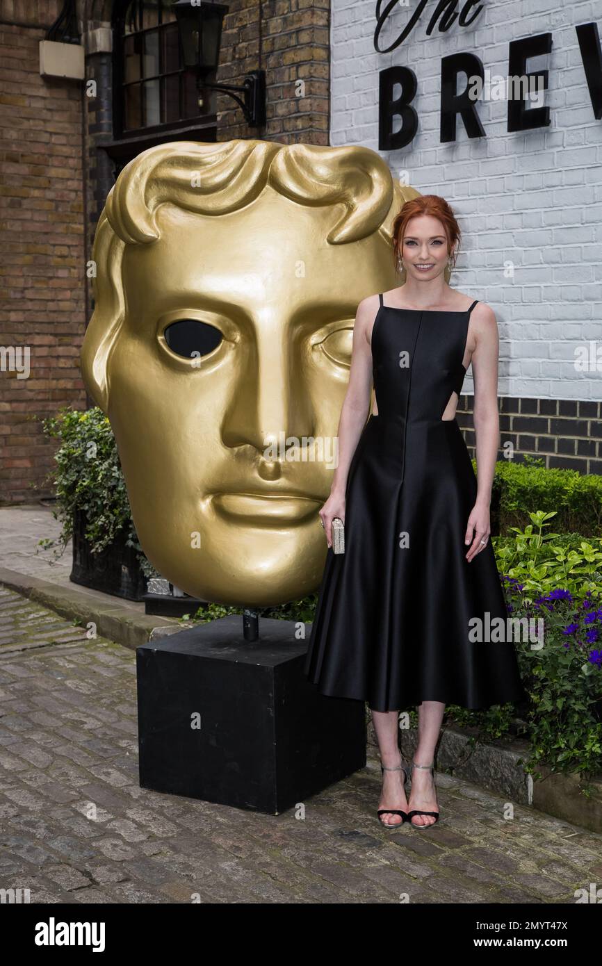 Actress Eleanor Tomlinson poses for photographers upon arrival at the ...