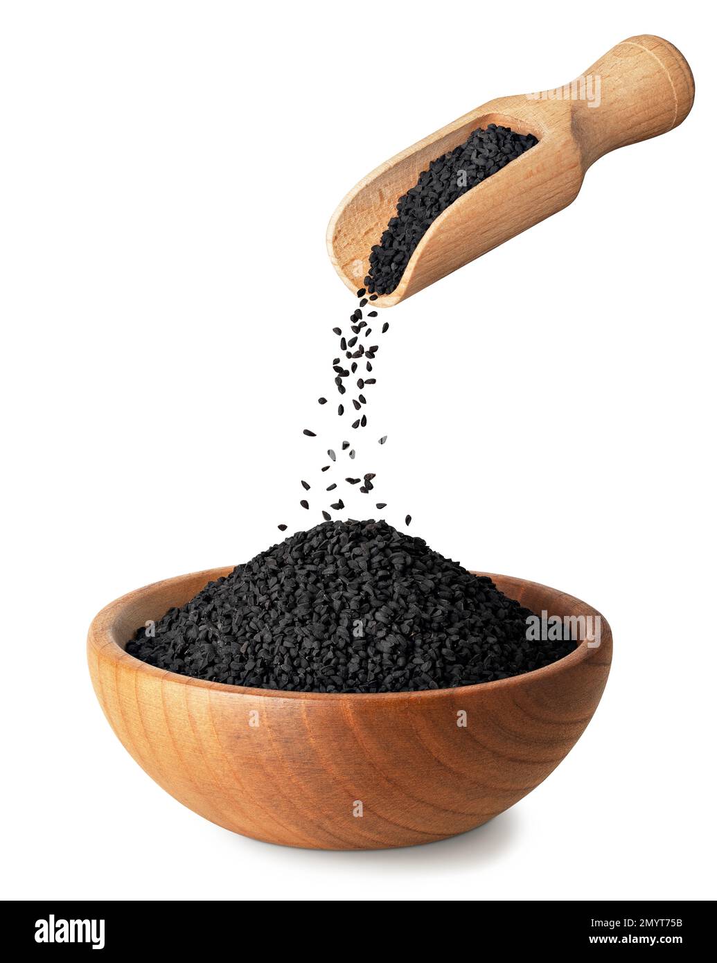 black cumin seeds pouring out from wooden scoop in bowl isolated on ...