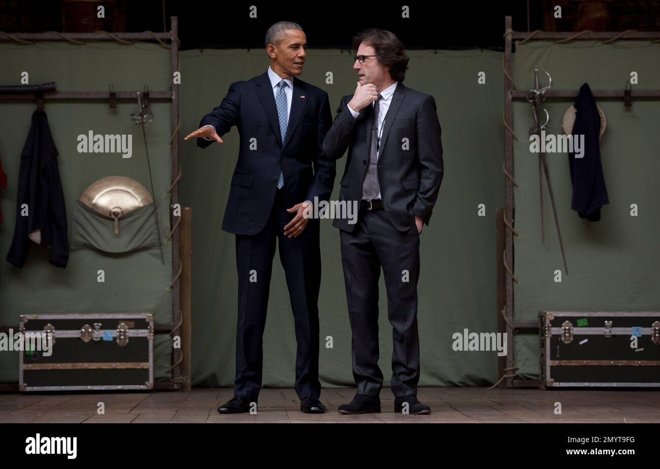 President Barack Obama stands on stage with Patrick Spottiswoode ...