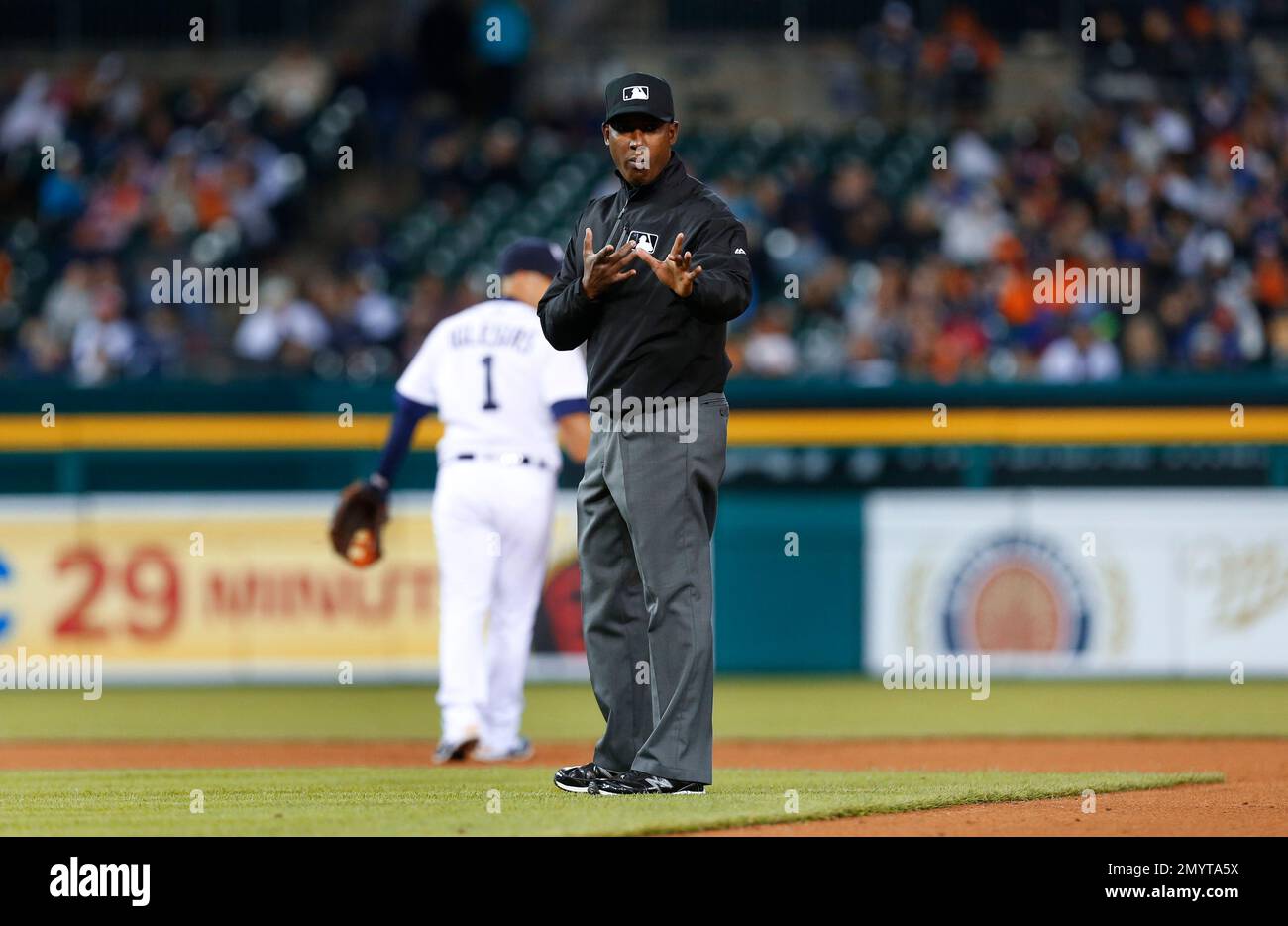 Second base umpire Ramon De Jesus signals in the eighth inning of a ...
