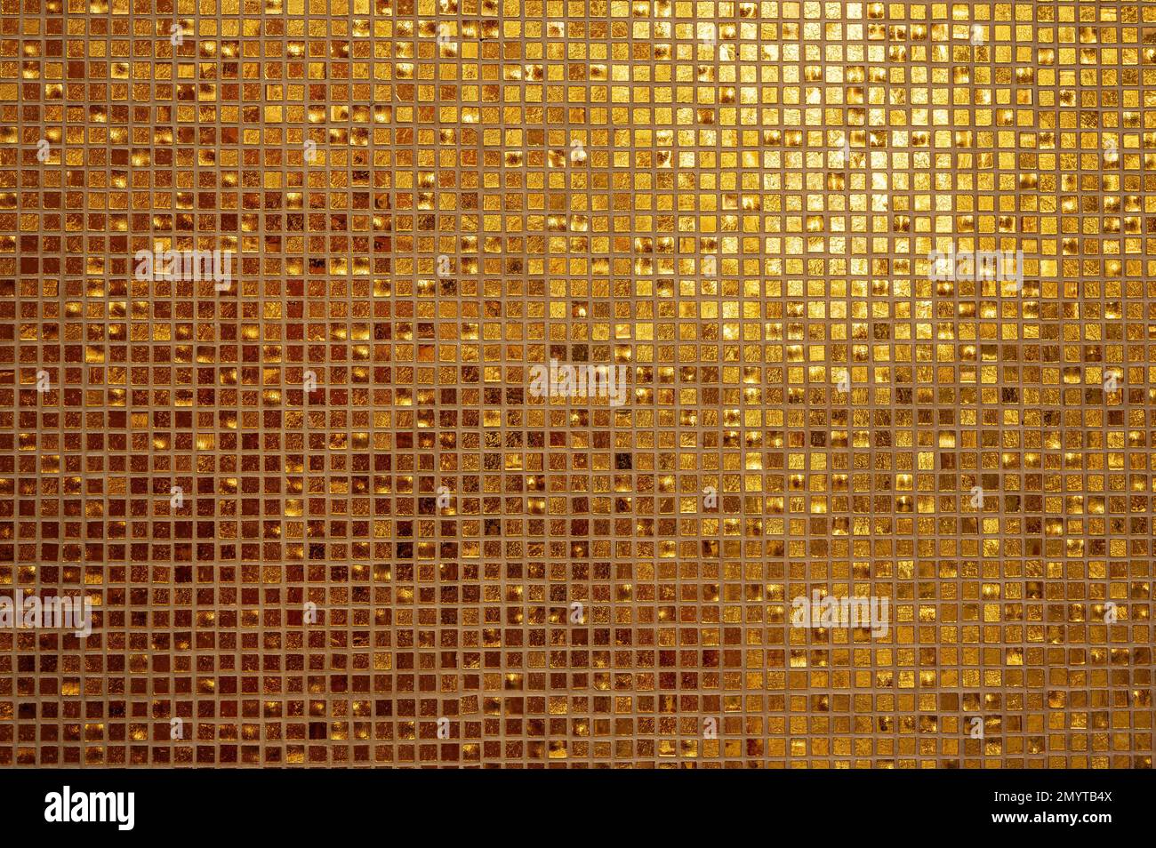 Small gold tile texture. Small golden tiles arranged to fit it into ...