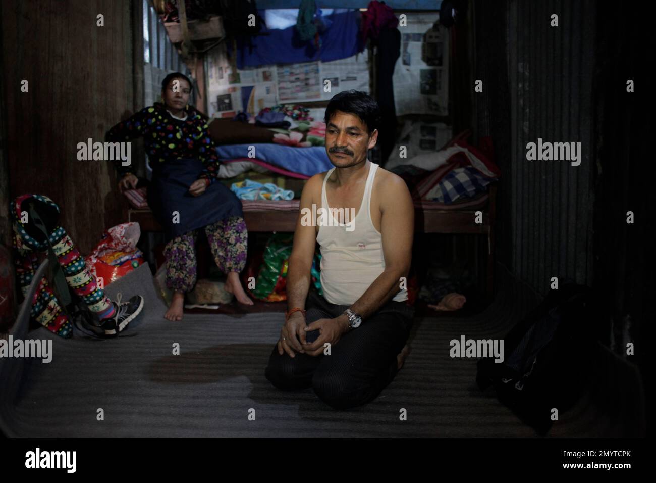 In this March 25, 2016 photo, Chitra Bahadur, foreground, and Maya Pariyar, both parents of ...