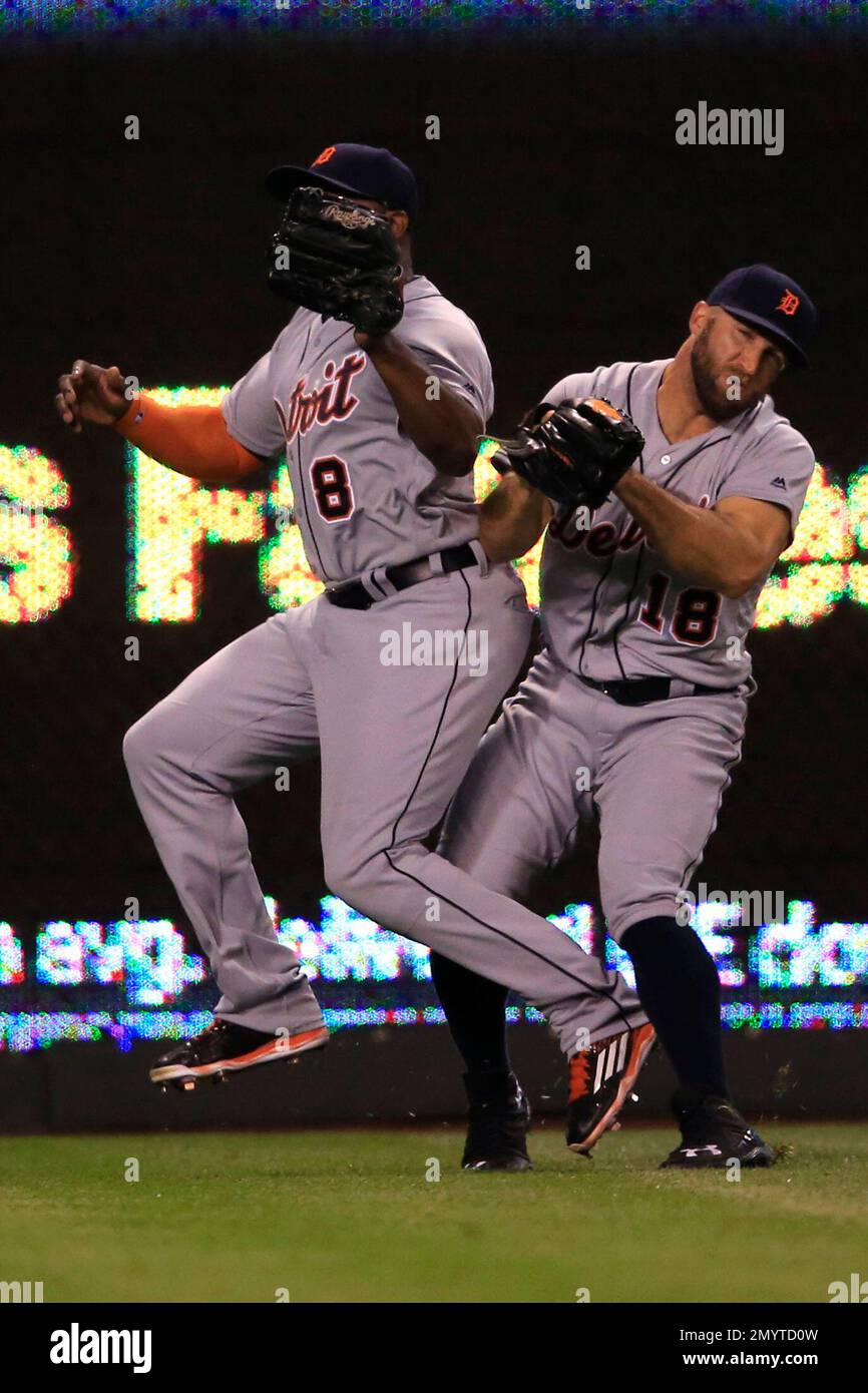 Detroit Tigers center fielder Tyler Collins (18) runs into left fielder ...