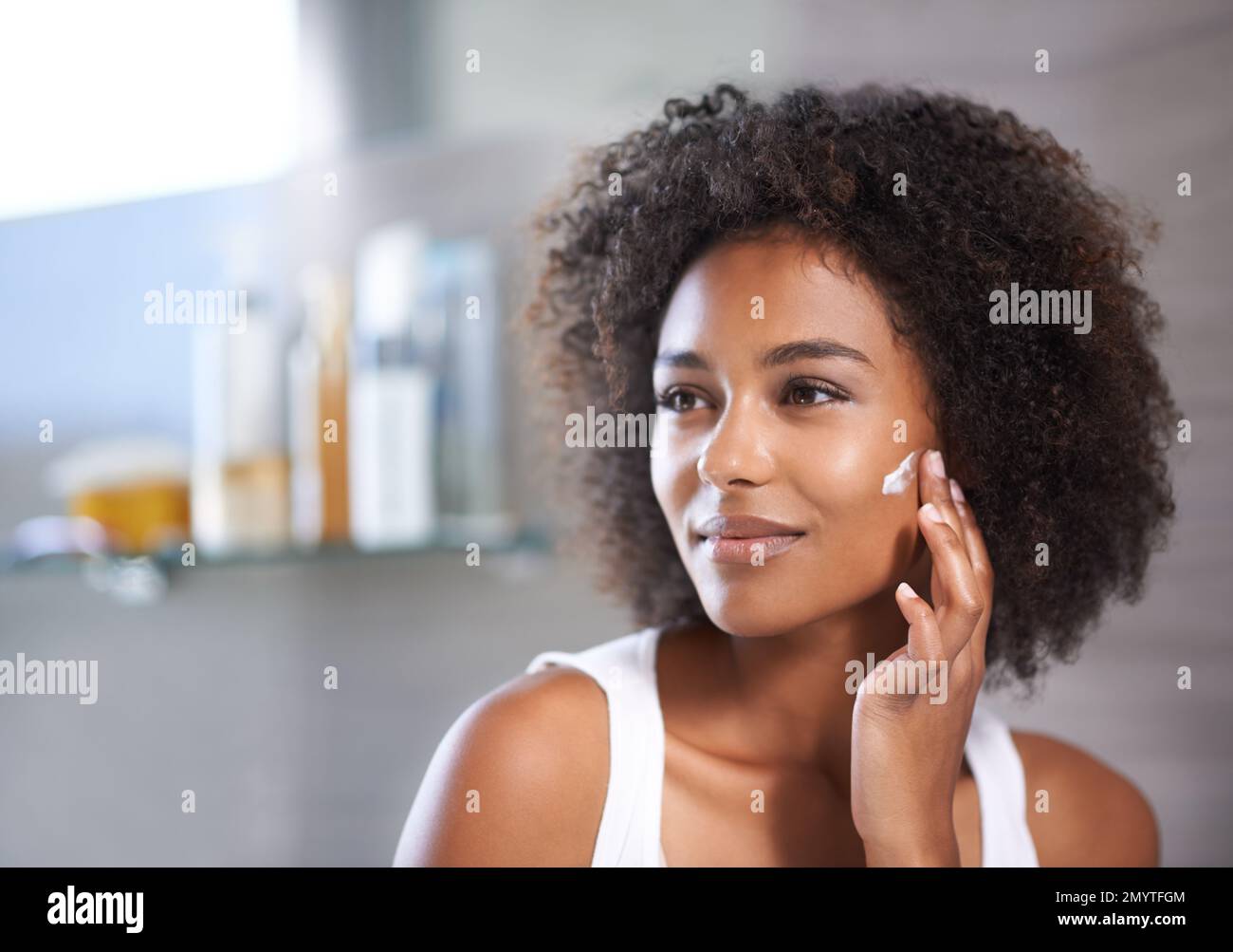 Being a fresh-faced beauty takes work. An attractive young woman ...