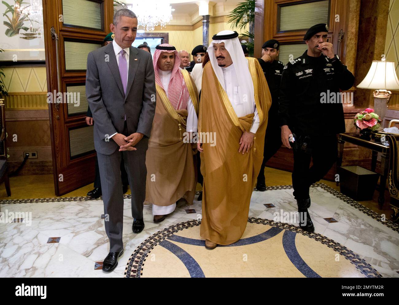 President Barack Obama and Saudi Arabia's King Salman walk together to ...
