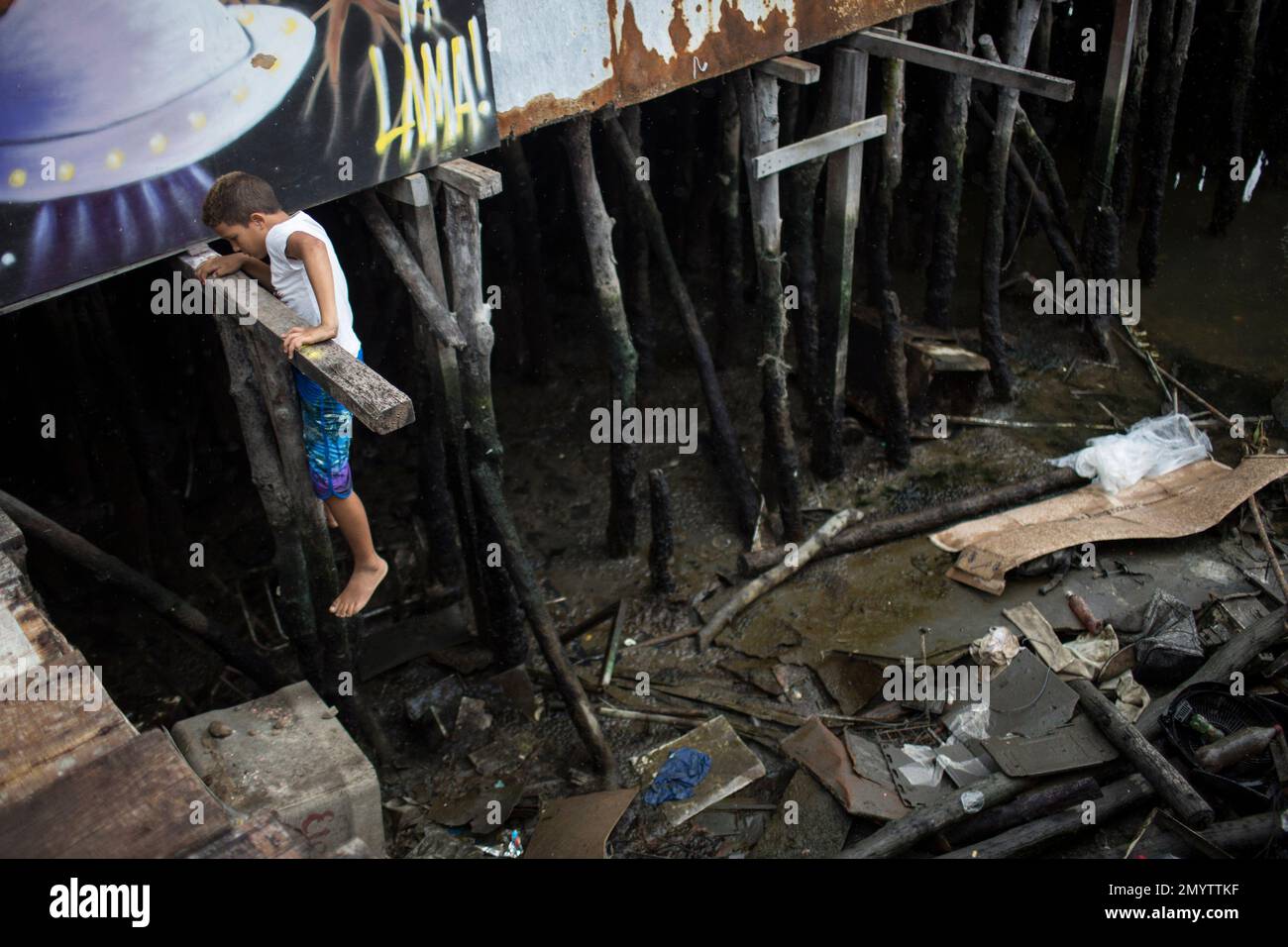 FILE - In this Jan. 29, 2016, file photo, a boy climbs a stilt house ...