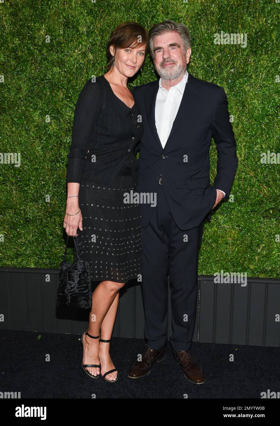 Actress Carey Lowell and boyfriend Tom Freston attend the CHANEL ...