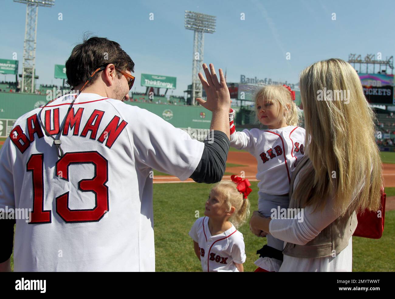 Boston Marathon bombing survivor Jeff Bauman, left, high-fives Landri ...