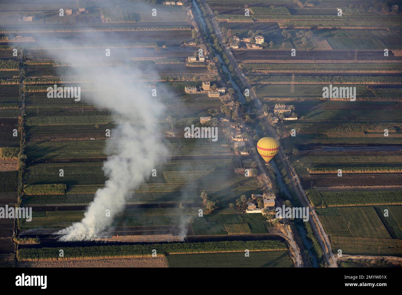 In this picture taken from a balloon Friday, April 1, 2016, smoke rises ...