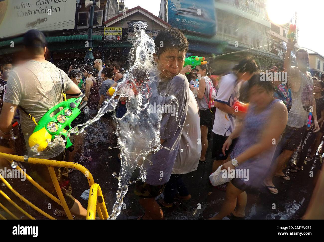 In this Wednesday, April 13, 2016 photo, local and foreign revelers douse each other with water ...