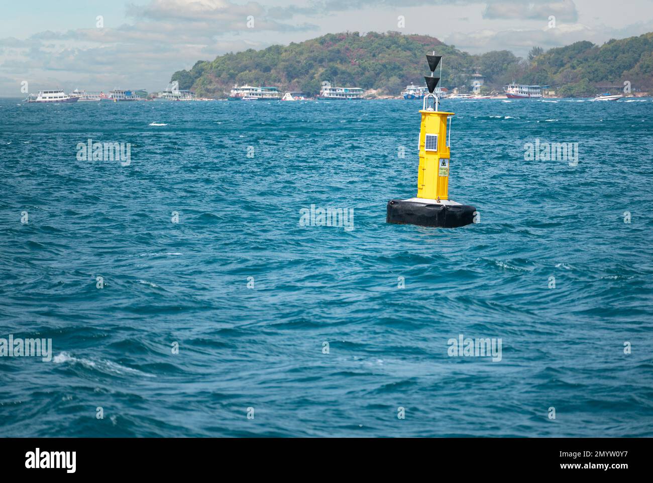 Marine buoy in fairway. Navigational signs. Escorting the ship to the ...