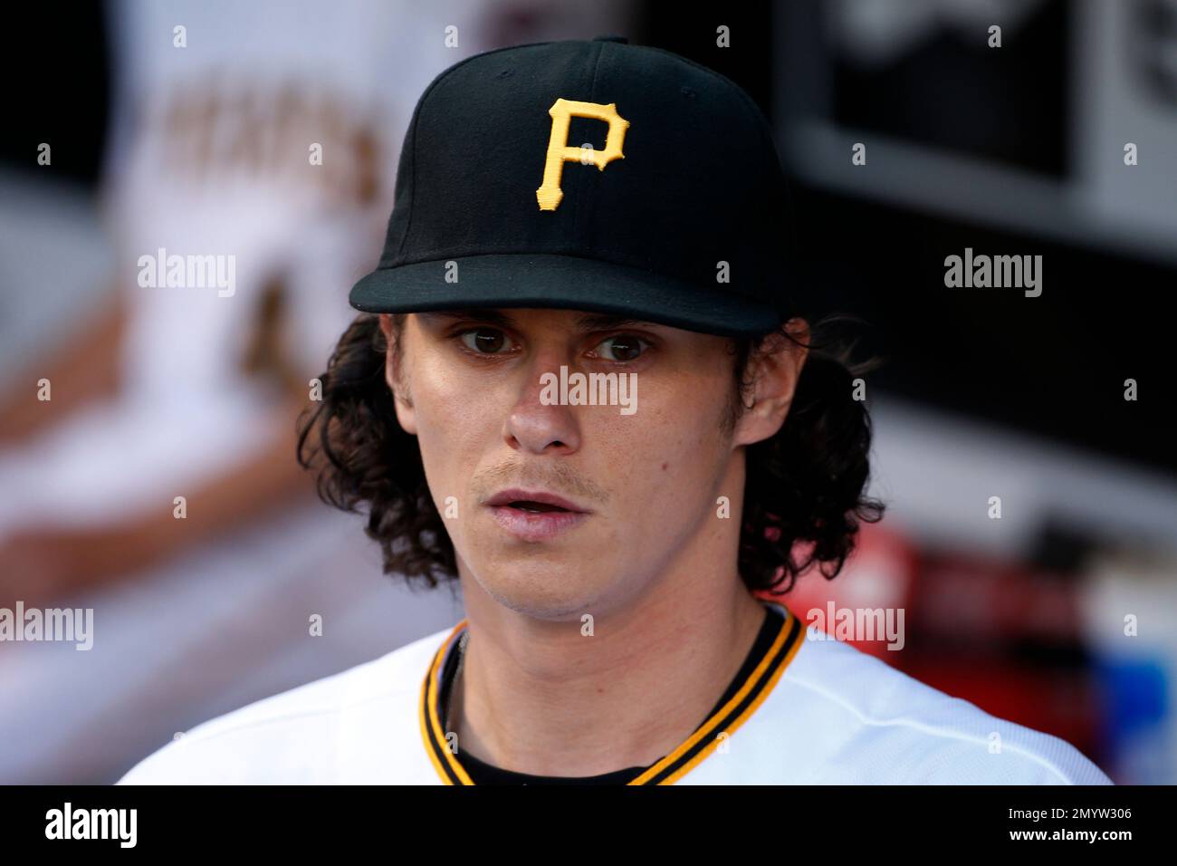 Pittsburgh Pirates starting pitcher Jeff Locke stands in the dugout ...