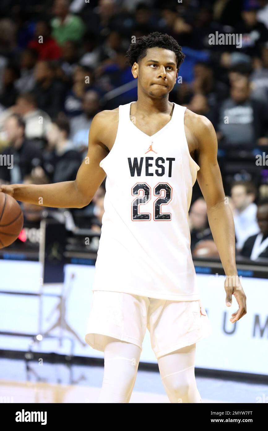 The West team's Marques Bolden #22 warms up against the East team ...
