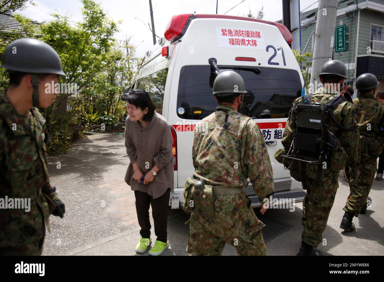 Yuriko Sakai bows to members of Japanese Self-Defense Forces after her ...