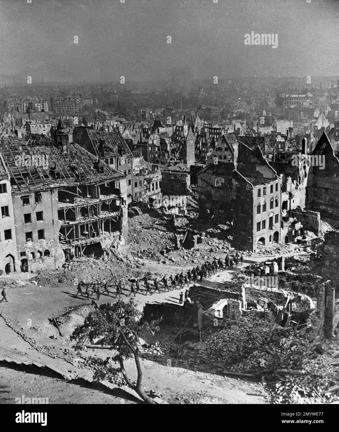 American troops file through Nuremberg after its capture, April 1945 ...
