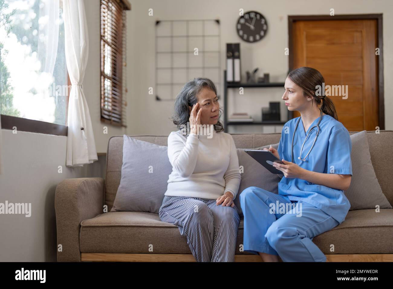 Doctors or nurse talking to explain medication and health care to ...