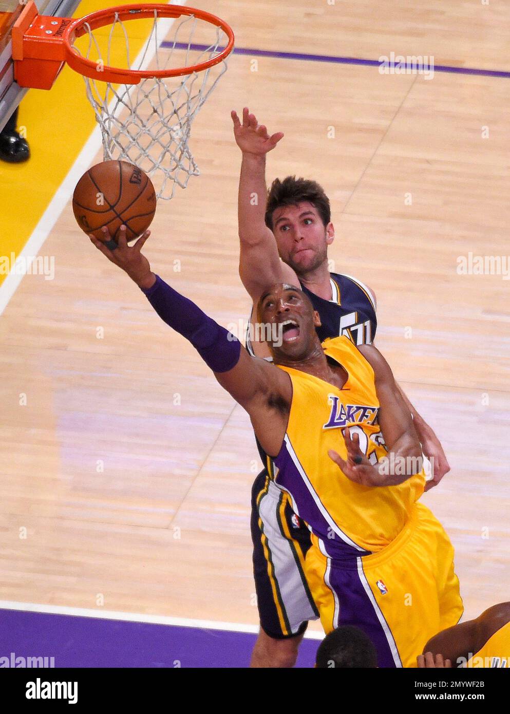 Los Angeles Lakers forward Kobe Bryant, below, shoots as Utah Jazz ...