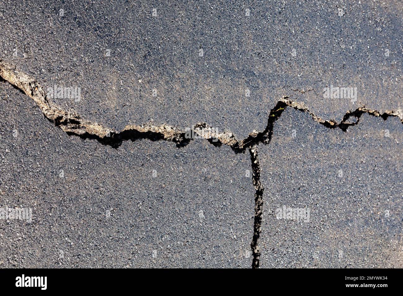 old damaged road with crack in asphalt Stock Photo - Alamy