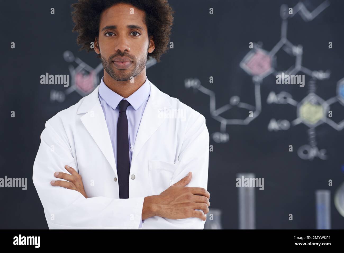 Chemistry is his thing. A male scientist standing in front of a ...