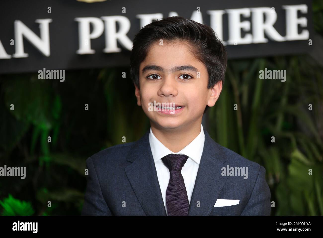 Actor Neel Sethi, who plays the character Mowgli, poses for ...
