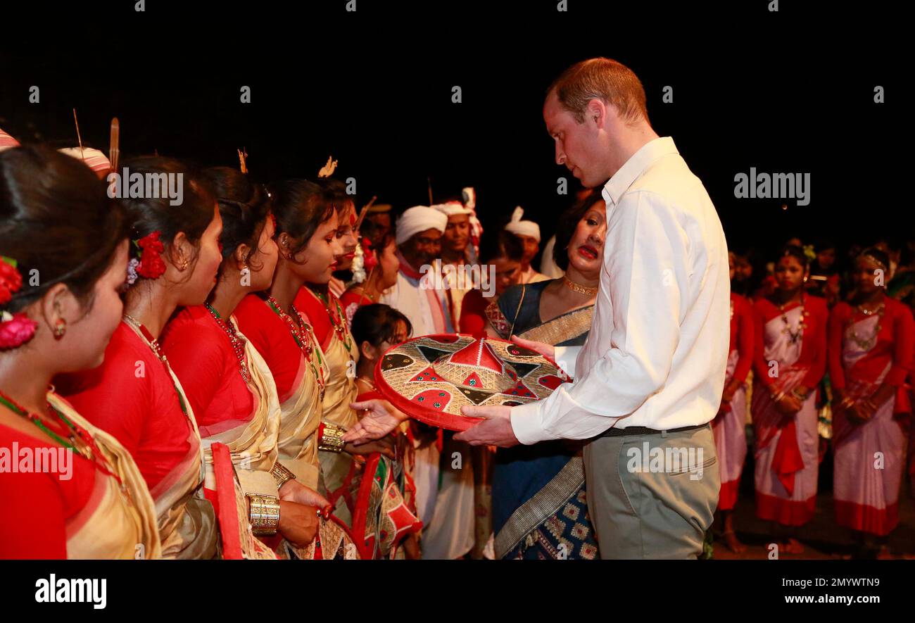Britain's Prince William, right, receives Jhapi, a traditional hat from ...