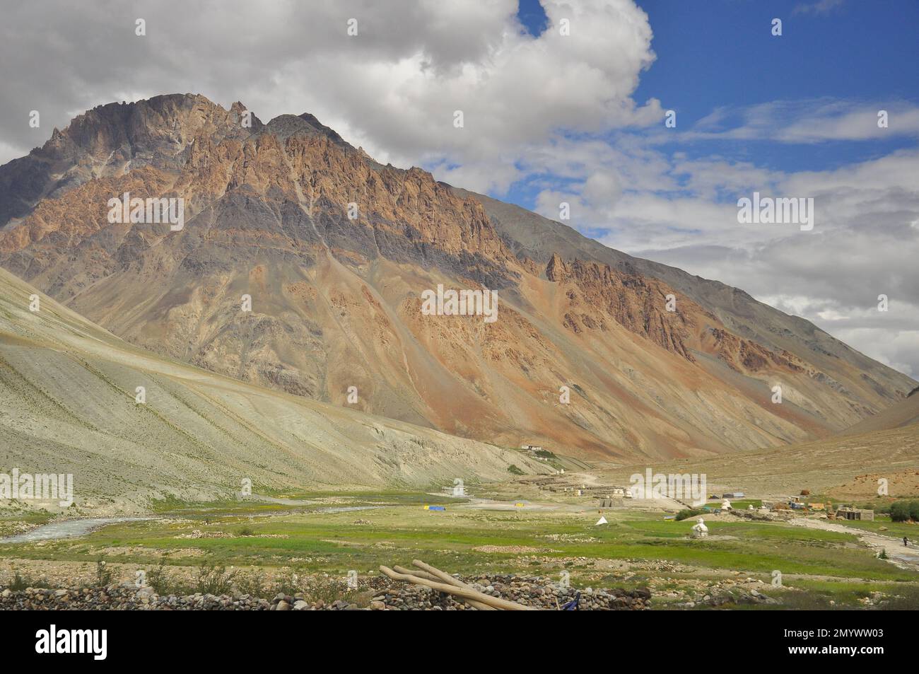 View of a beautiful rocky mountain with clouds in sky and flowing a ...