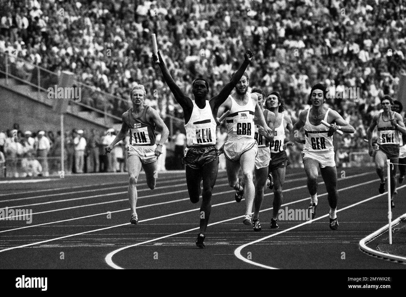 Kenya's Julius Sang raises his arms in victory while crossing the ...