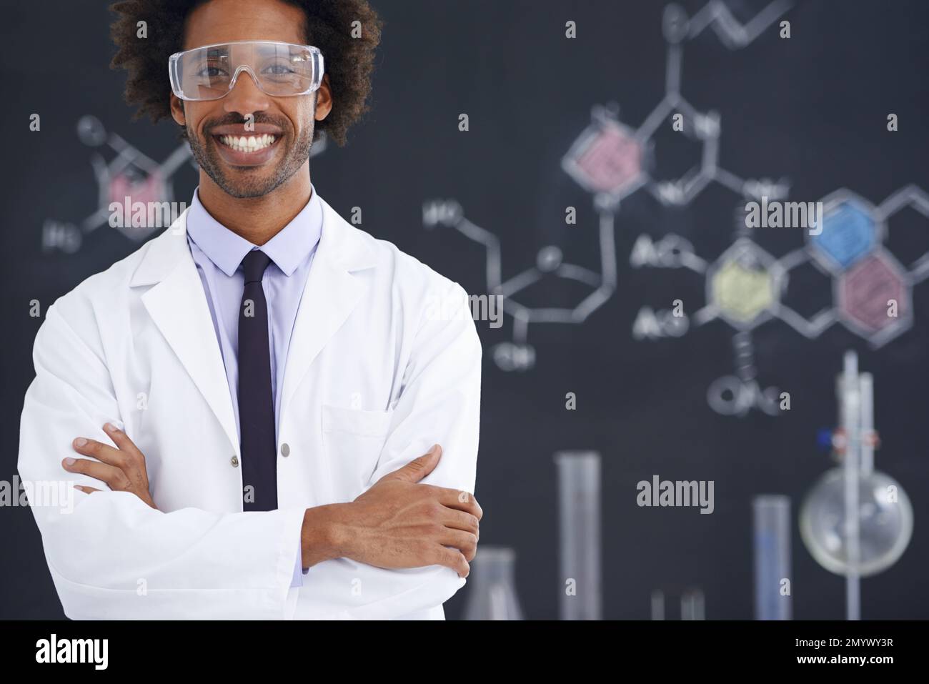 Chemistry excites him. A male scientist standing in front of a ...