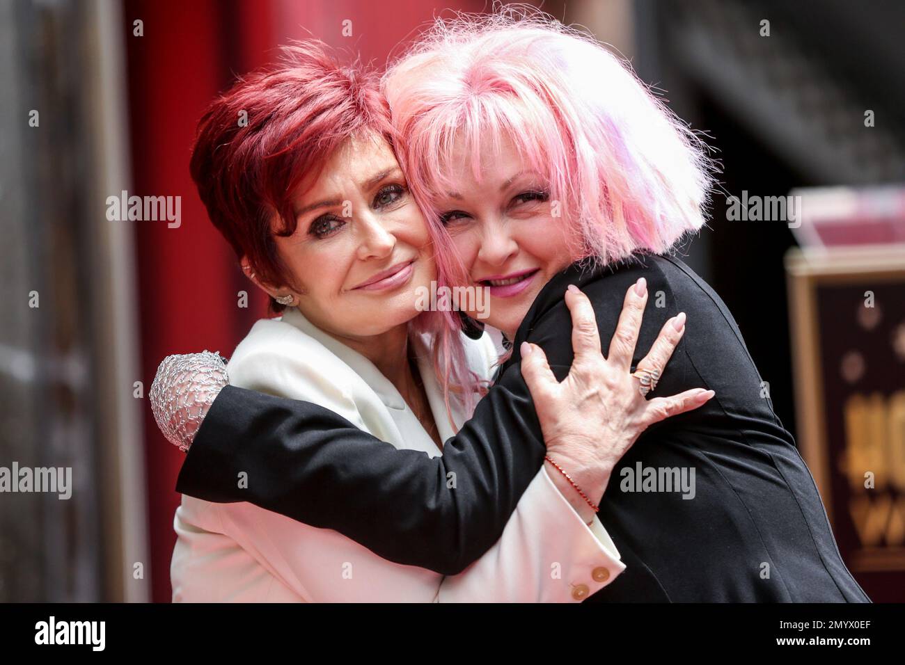 Sharon Osbourne, left, and Cyndi Lauper attend a ceremony honoring ...