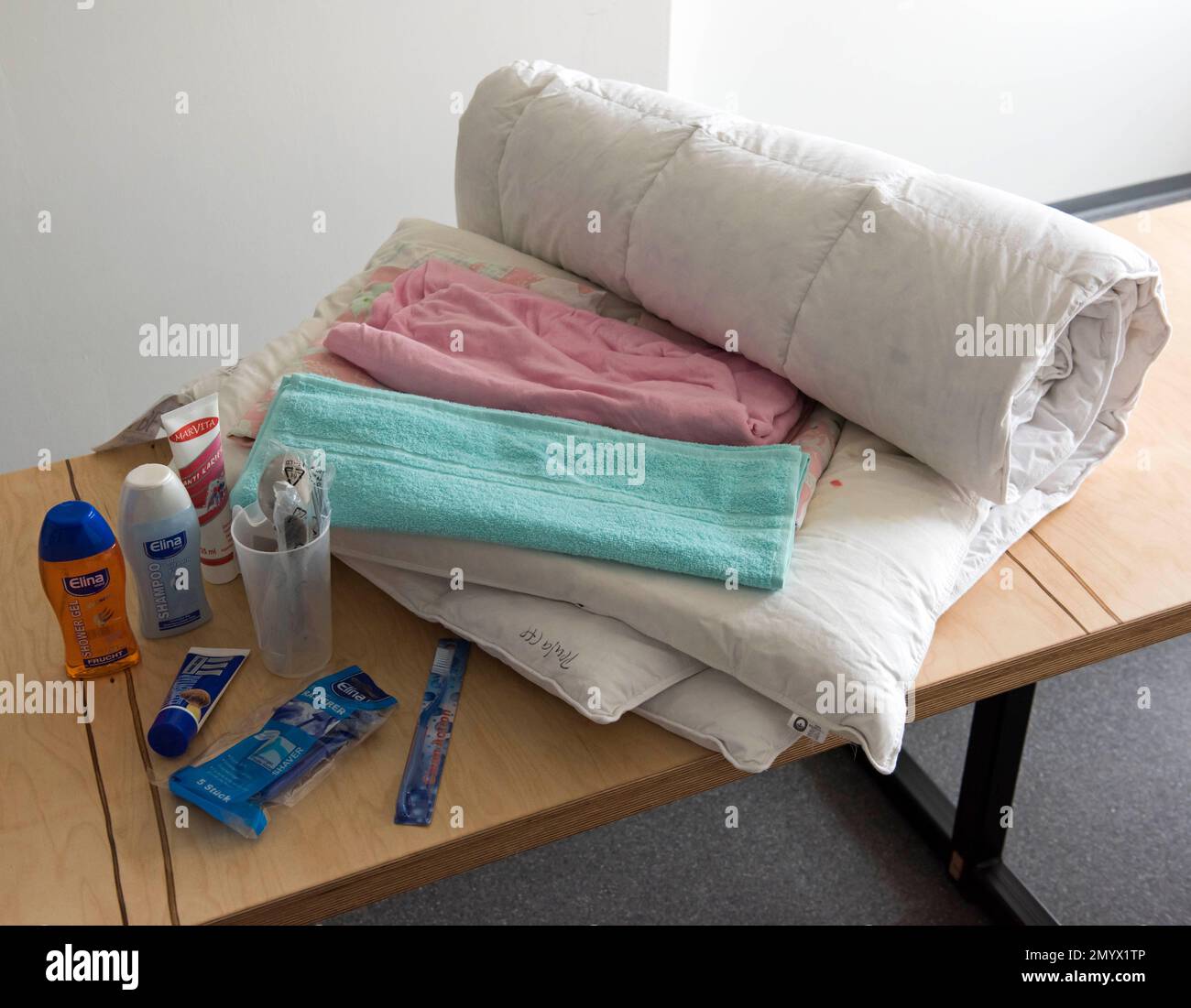 Parts of a welcome package are arranged in a future initial reception ...