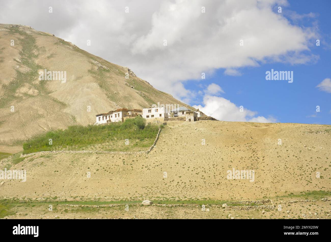 View of traditional Ladakhi houses along the dry hills on the way to ...