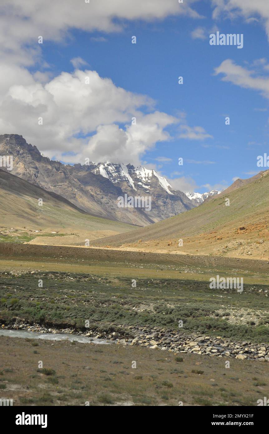 Glacier view in between dry mountains in Darcha-Padum road with clouds ...