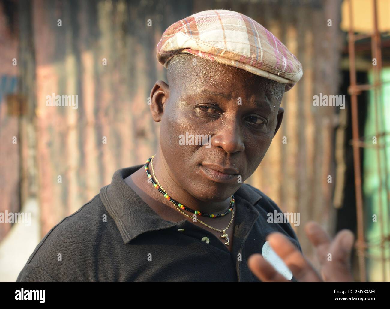 In this April 4, 2016 photo sculptor Andre Eugene speaks to a friend ...