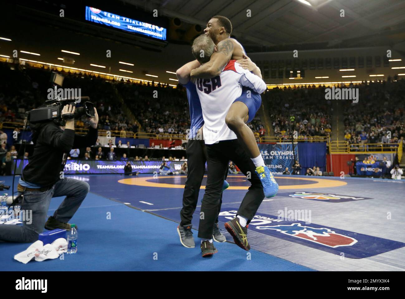 Jordan Burroughs celebrates with his coaches after beating Andrew Howe ...