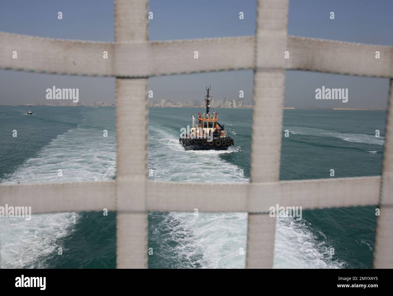 Military boats and the coastline of Manama, Bahrain, are photographed ...