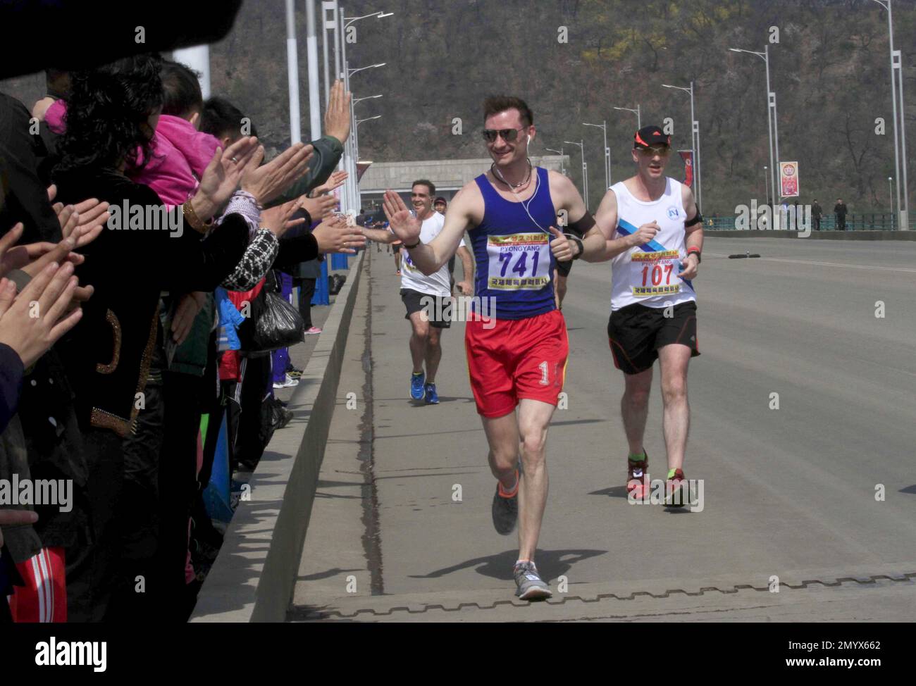 Runners are cheered by North Koreans during the Mangyongdae Prize ...